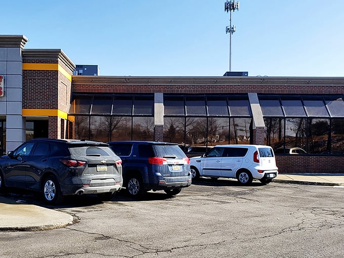The parking lot—where breakfast pilgrimages begin and end, with cars full of satisfied customers plotting their return visits.