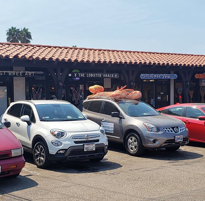The giant lobster on the car roof isn't just decoration – it's a beacon guiding hungry souls to lobster salvation in this unassuming strip mall.