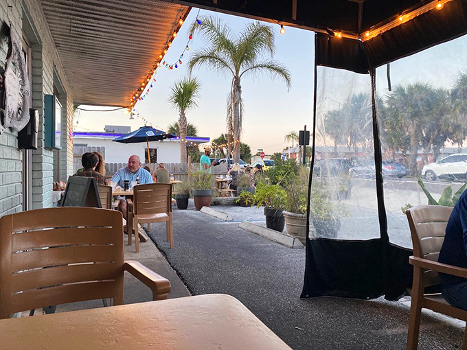 Outdoor seating where palm trees sway and conversations flow as easily as the wine. Florida dining at its most relaxed.