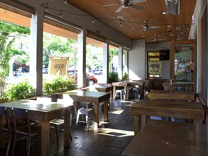Sunlight streams through windows, illuminating wooden tables where memories are made between bites of smoked perfection.