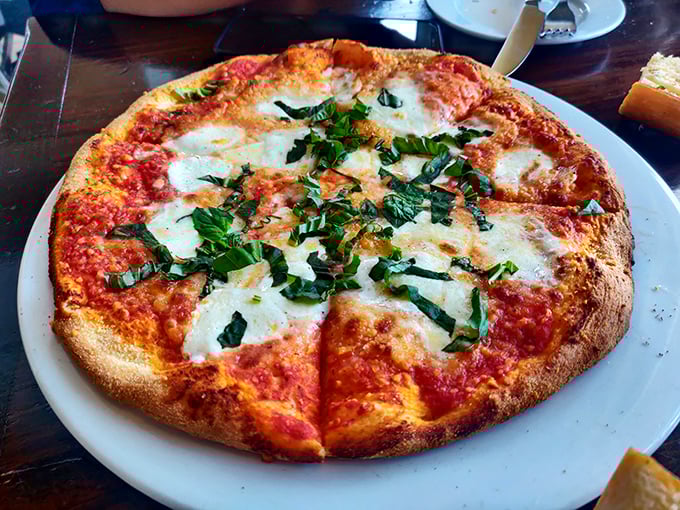 This pizza isn't trying to be Neapolitan or New York—it's confidently Californian, with a crust that's achieved the perfect balance of chew and crunch.