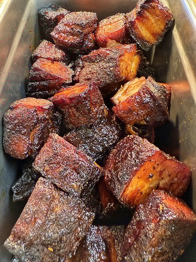 Burnt ends aren't mistakes – they're barbecue's greatest achievement, like meat candy that's been kissed by fire and time.