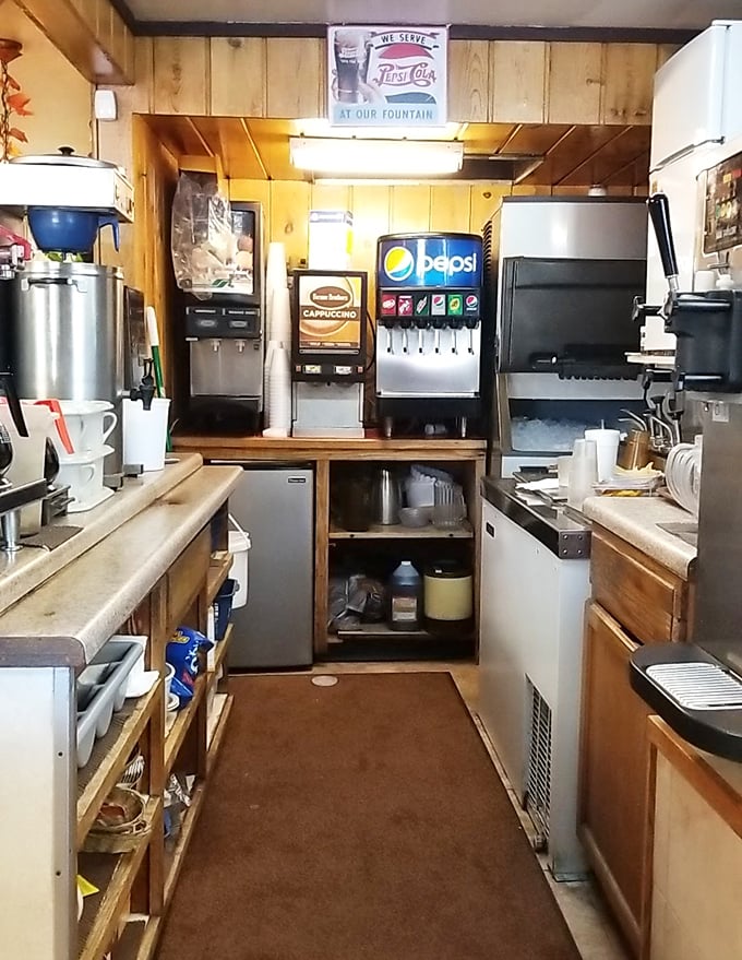 Behind-the-scenes magic where coffee is always brewing and the soda fountain stands ready. The engine room of diner happiness.