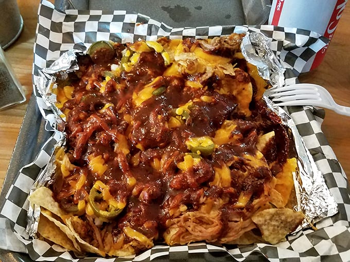 BBQ nachos that redefine indulgence – pulled pork, melted cheese, and jalapeños creating a flavor explosion that makes sharing nearly impossible.