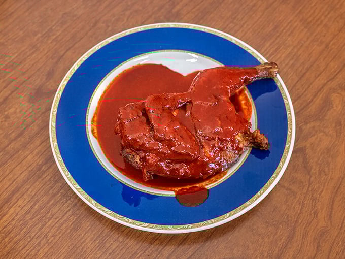 Barbecued chicken swimming in that signature sauce – proof that Parks doesn't play favorites between pork, beef, or poultry.