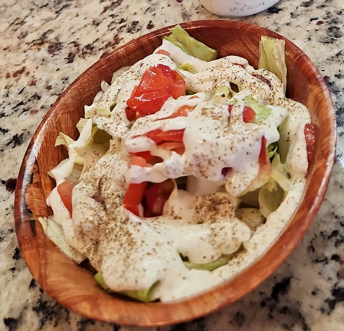 This isn't just salad—it's a cool, crisp counterpoint to burger indulgence, dressed with the kind of homemade touch that chain restaurants can only dream about.