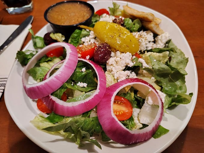 A Greek salad that brings Mediterranean sunshine to South Carolina. Those red onion rings are practically jewelry for your lettuce.