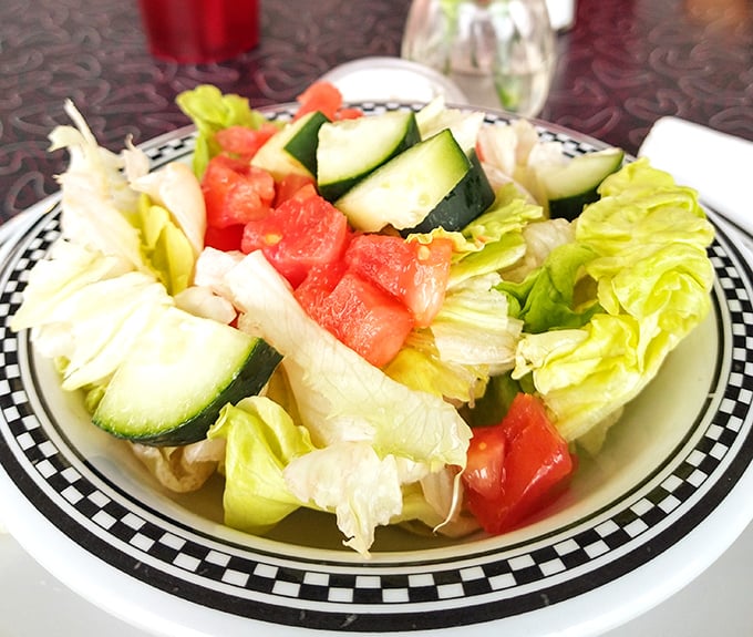 A simple side salad that somehow tastes better in a diner, especially when it's served on those iconic checkered-rim plates.