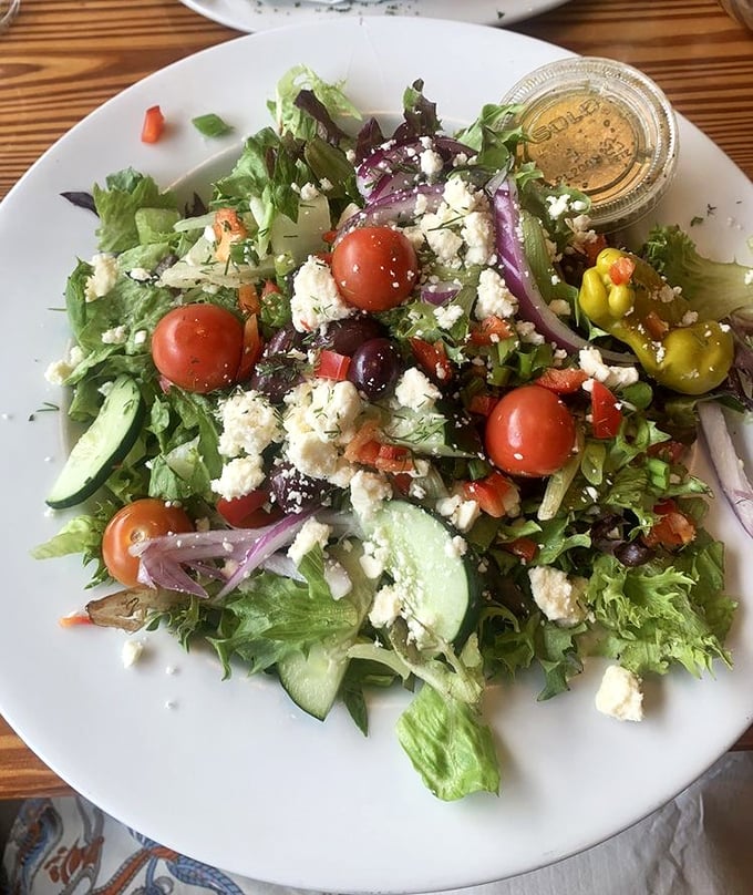 A Greek salad that brings freshness to the table – crisp greens, vibrant tomatoes, and feta that tastes like it just arrived from Athens.