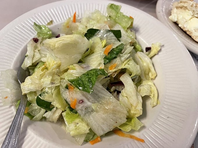 The house salad—crisp, bright, and palate-cleansing—the unsung hero preparing you for the pasta marathon ahead.