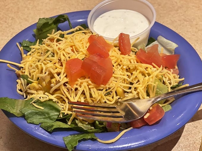This isn't just a side salad—it's what you eat to convince yourself that ordering three hot dogs was a balanced dietary decision.