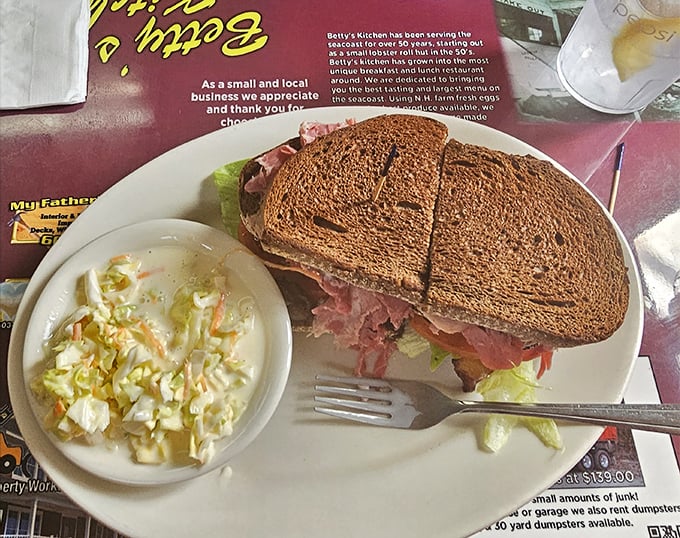 This isn't just a sandwich – it's architecture with mayo. The coleslaw isn't a side dish; it's a cooling agent for flavor explosions happening between bread slices.