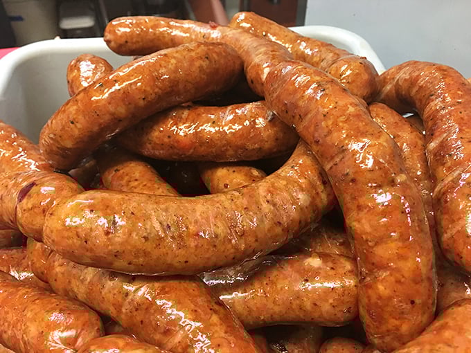 These sausages aren't just links – they're glistening promises of juicy, spiced perfection waiting to join your barbecue spread.