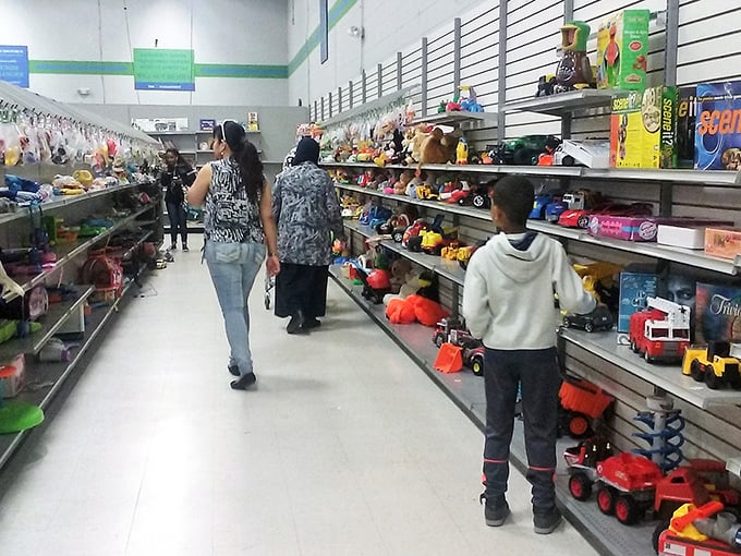 Families browsing the toy section together – creating memories while hunting for memories someone else discarded.