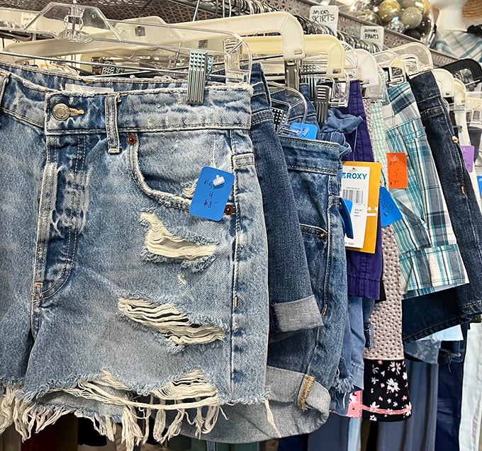 Denim stories hanging in a row—some with chapters already written in their distressed details, others waiting for new adventures.