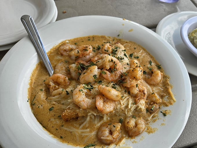 Shrimp and grits swimming in creamy sauce—a Southern romance story where neither party is playing hard to get.
