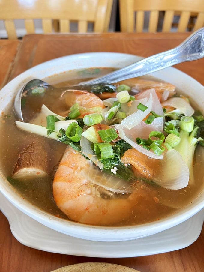 Sinigang soup that could cure whatever ails you. Those shrimp swimming in broth aren't just ingredients—they're little life rafts of flavor.