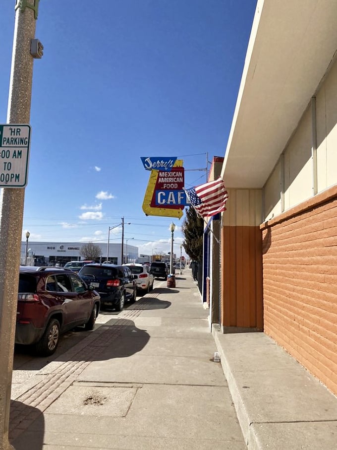 That vintage neon sign pointing the way is like a beacon for hungry travelers cruising down historic Route 66 looking for authenticity.