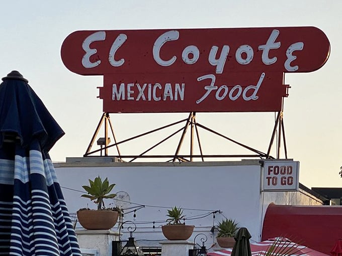 The sign says "Food To Go," but trust me, you'll want to stay. El Coyote isn't just a meal—it's an experience.