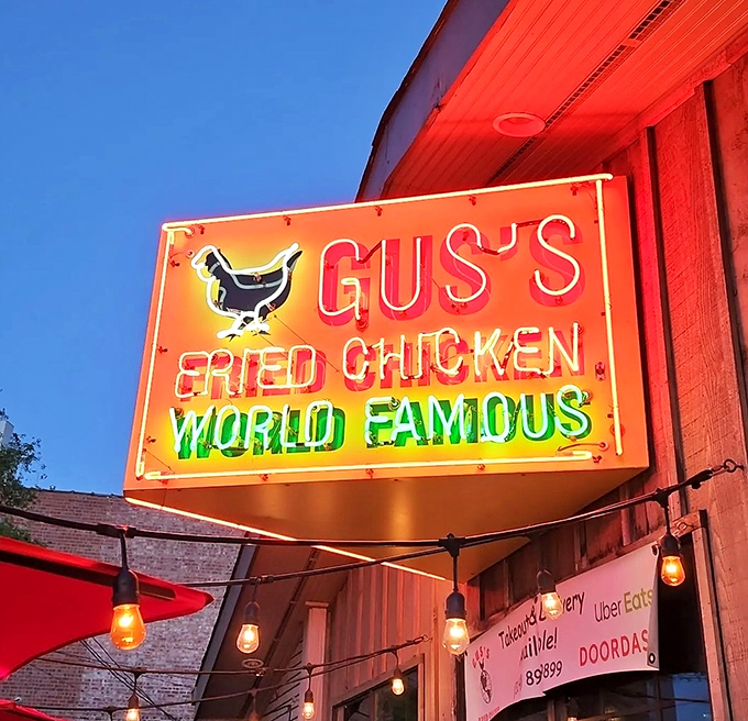 The neon chicken sign glows like a beacon in the night, guiding hungry travelers to spicy salvation. Follow the light.
