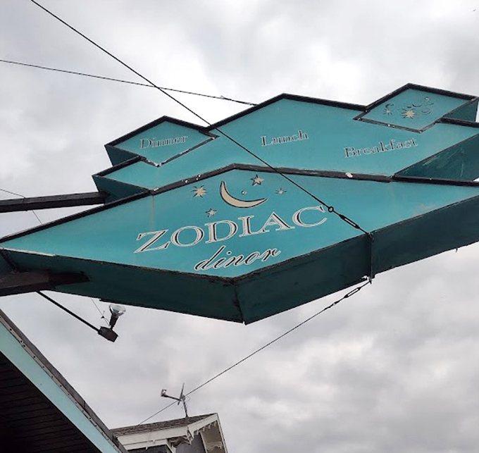 The distinctive Zodiac sign proudly announces "Dinner, Lunch, Breakfast"—though locals know it's the morning meal that steals the cosmic show.
