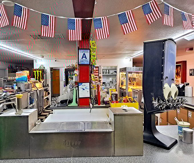 American flags flutter above the concession area, where movie magic begins with the perfect snack combination.