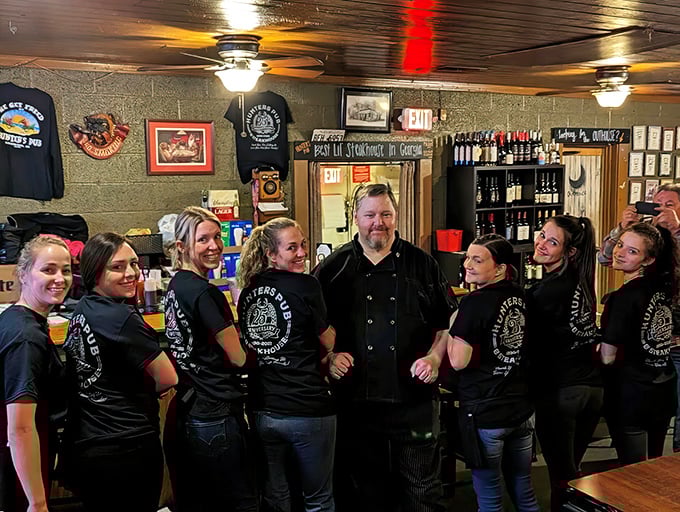 A team that wears their restaurant pride on their sleeves—literally—suggesting this isn't just a job, but a culinary family.