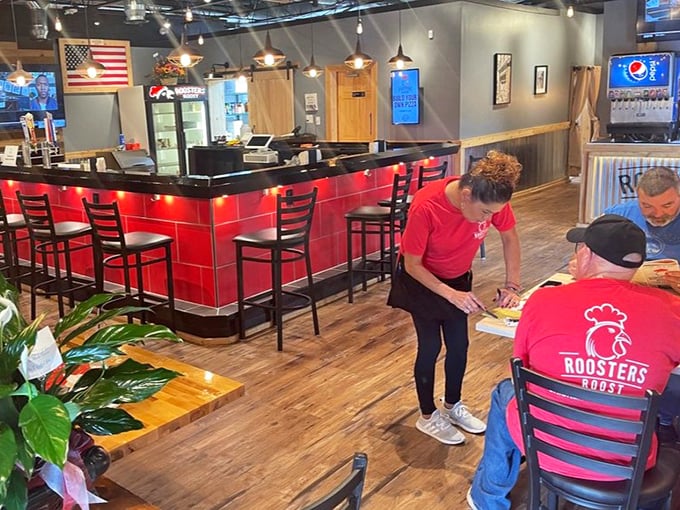 Service with a smile and those signature red shirts. When staff wear the restaurant logo proudly, it usually means they believe in what they're serving.