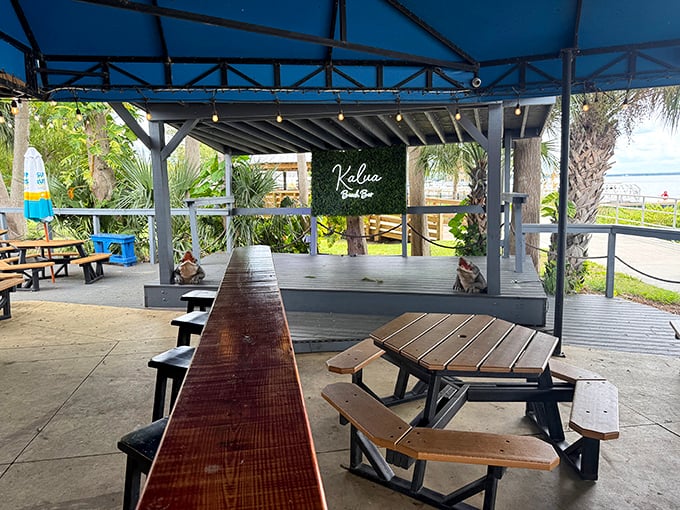 The stage area proves food isn't the only attraction. Live music and lake breezes create the soundtrack to memories you'll be humble-bragging about later.