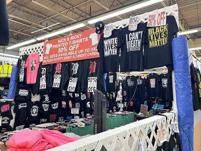 T-shirt vendors offering wearable opinions and local pride—because sometimes you need your chest to do the talking before your mouth gets the chance.