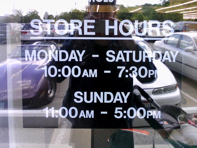 Store hours posted clearly—the golden schedule for treasure hunters planning their next expedition into the land of secondhand gold.