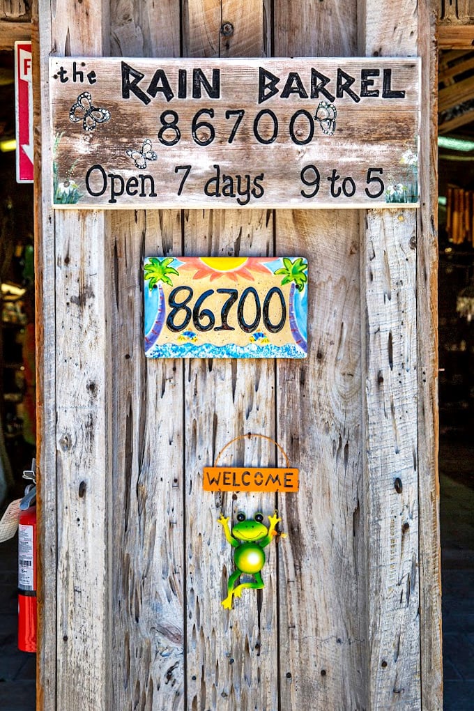 Even the hours sign embraces the whimsical spirit with a dangling frog greeter. In the Keys, even business information comes with a side of fun.