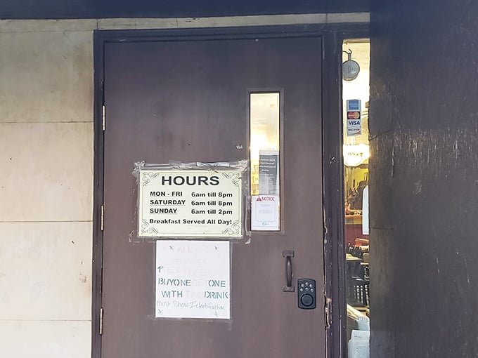 The unassuming door with its hours posted is the gateway to a breakfast paradise that thankfully serves its morning magic all day.