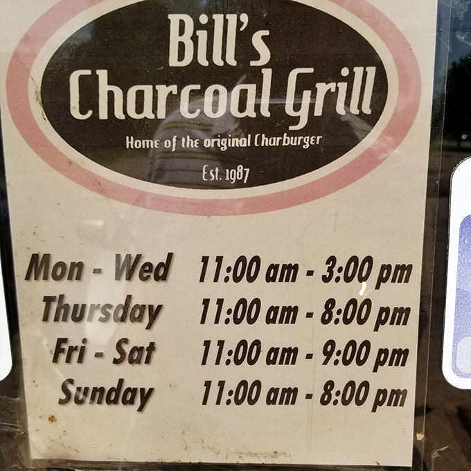 The hours sign reveals the rhythm of a local institution. Note Thursday's late closing—clearly burger night for those in the know.