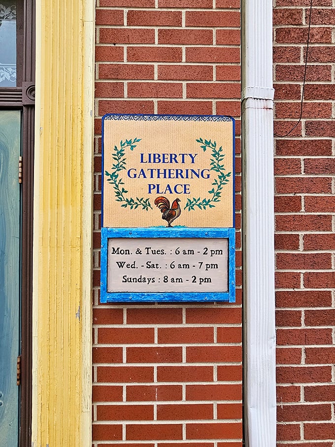 The hours sign with its cheerful rooster logo promises early breakfasts and hearty dinners. A schedule that respects both early birds and dinner crowds.
