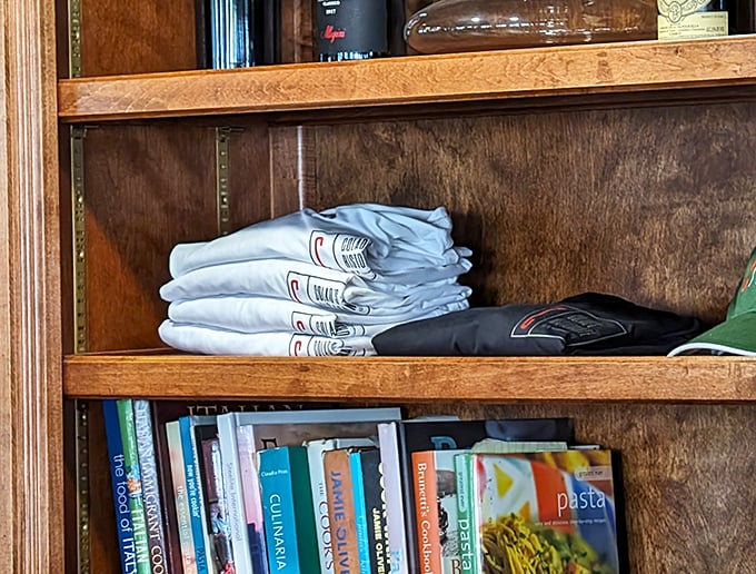 Even the bookshelves speak of passion – cookbooks and neatly folded shirts suggest this isn't just a restaurant, but a lifestyle.