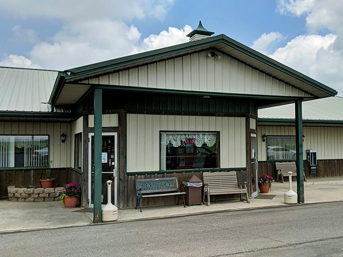 The storefront welcomes visitors with benches that say, "Sit a spell before or after your meal." Midwestern hospitality in architectural form.