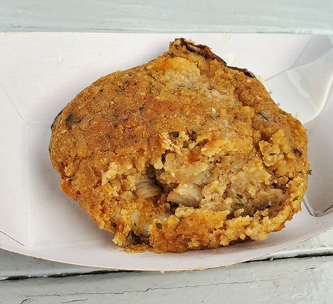 The humble-looking stuffed clam that delivers an explosion of seasoned goodness – proof that appearances can be deliciously deceiving.