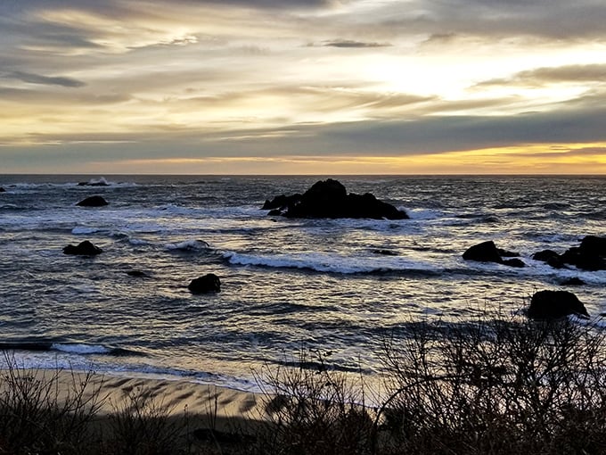 Sunset transforms the rugged coastline into a painting worthy of a gallery. The rocky outcroppings create nature's own sculpture garden against the golden light.