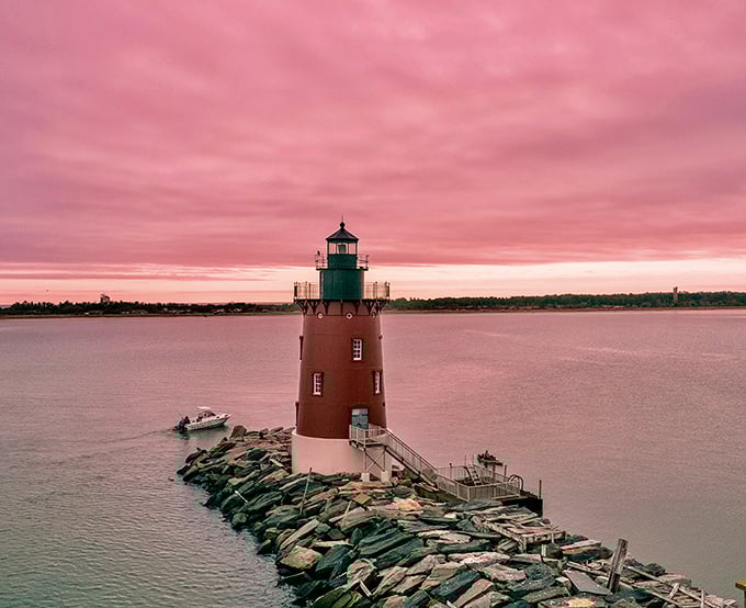 Cotton candy skies frame the lighthouse in nature's perfect portrait. Even the most jaded travelers pause their phones to witness this spectacle.