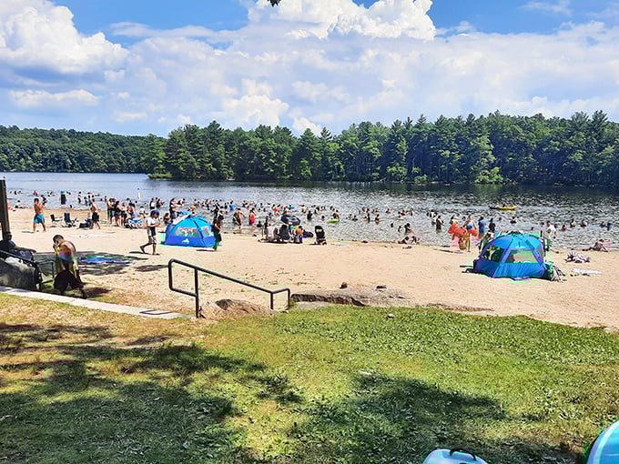 Peak summer joy captured in one frame—where the beach becomes everyone's living room and strangers become temporary neighbors in aquatic bliss.