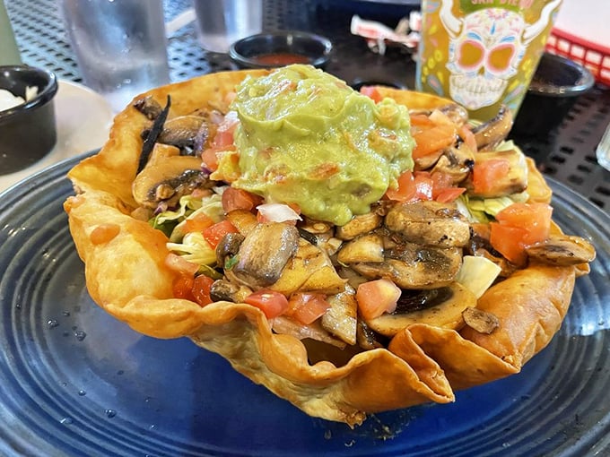 A taco salad that rejected the boring bowl concept in favor of a crispy tortilla fortress protecting a kingdom of fresh toppings.