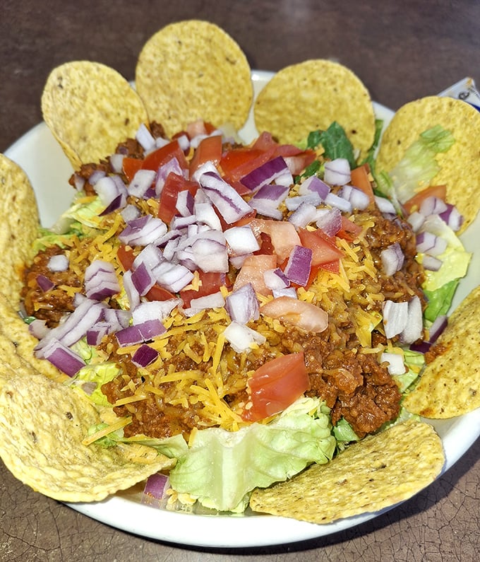 Taco salad served in its own edible bowl – a fiesta of flavors that proves this diner knows its way around more than just breakfast.
