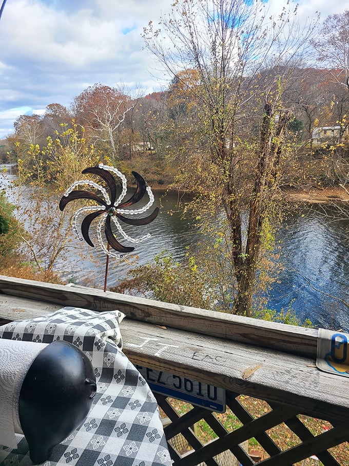 The riverside view adds unexpected serenity to your meat sweats. Nature's dining room improves everything—even perfect barbecue.