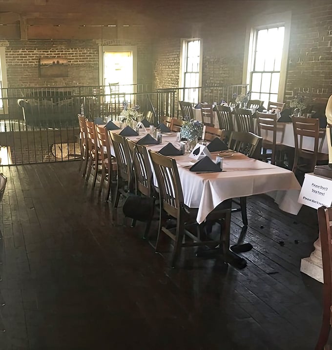 Upstairs dining offers a bird's-eye view of culinary magic below—wooden floors that have supported generations of special occasions and everyday celebrations.