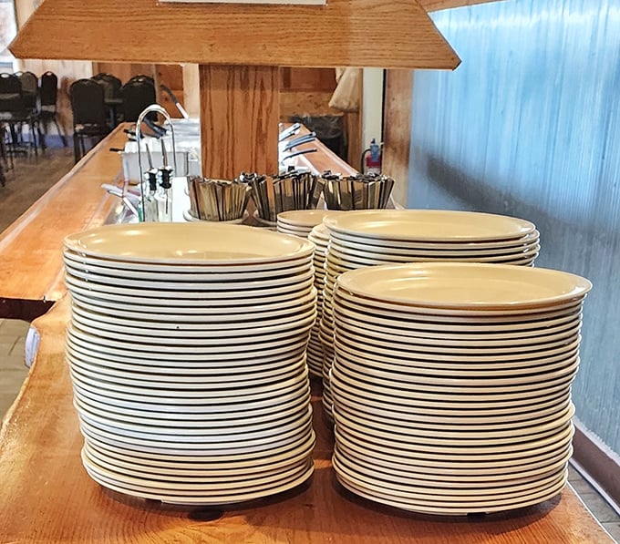Stacks of plates waiting for their moment of glory – soon to be the canvas for Cajun masterpieces.