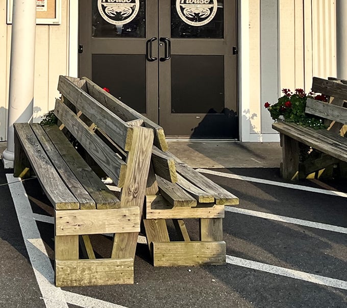 Weathered wooden benches outside the entrance—the perfect spot for contemplating the feast that awaits within.