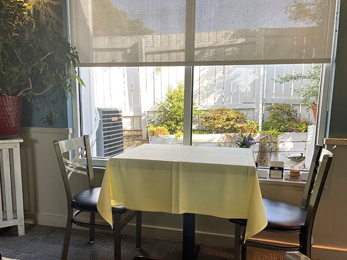 Window seating offers a tranquil spot for contemplative dining, where natural light complements the thoughtfully prepared cuisine.