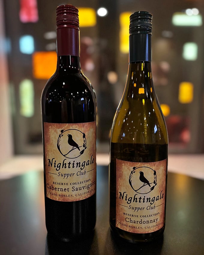 House wines bearing the Nightingale label – liquid companions waiting to complement your meal with California sunshine in every sip.