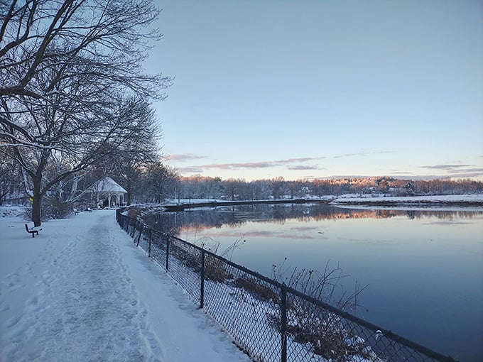 Winter's hush blankets Swasey Parkway in snow while the river refuses to freeze, a perfect metaphor for Exeter's blend of tranquility and persistent energy.